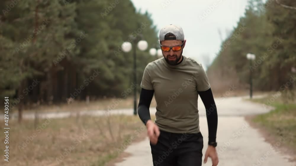 Running Man In Slow Motion Jogging At Sunset.Runner Cardio Exercising ...