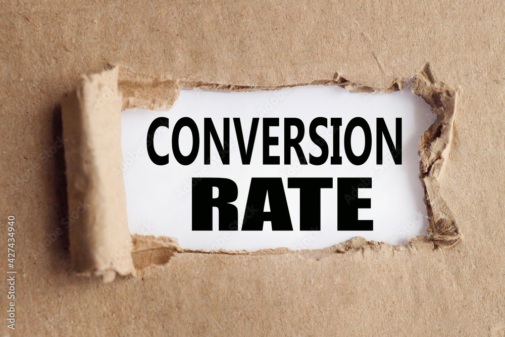 conversion rate.text on white paper over torn paper background. Stock ...