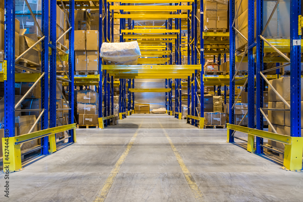 Interior of a modern warehouse storage with rows and goods boxes on ...