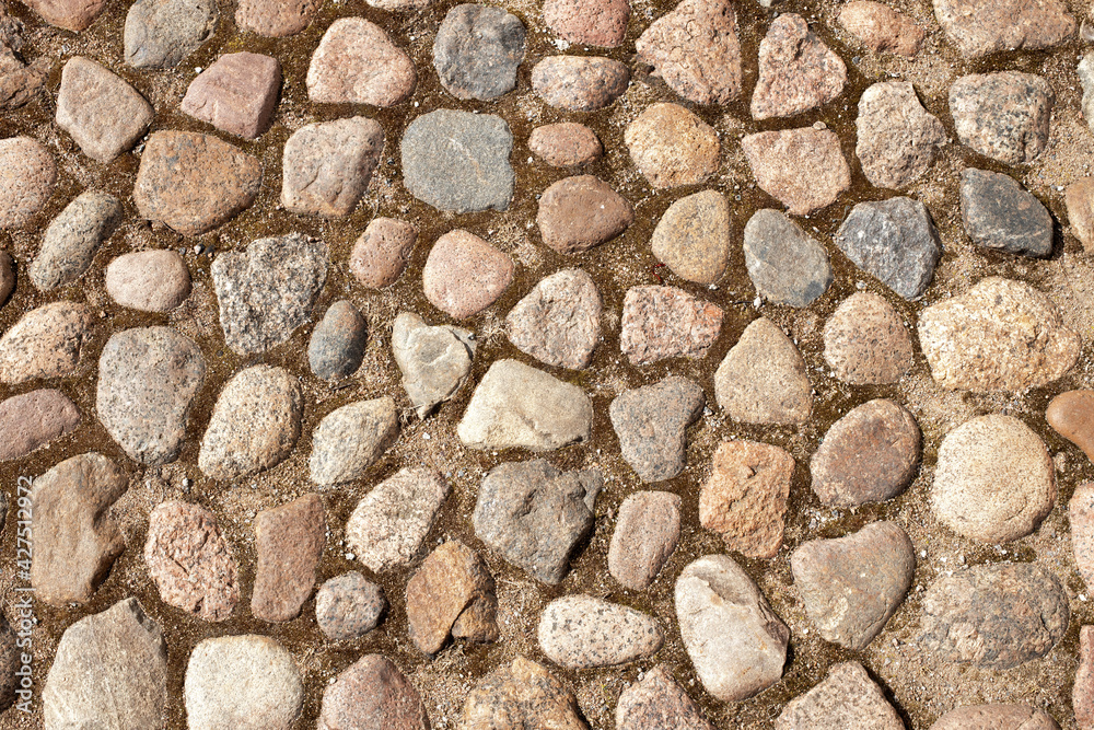 old street cobbled with round cobblestones, top view, road or square in ...
