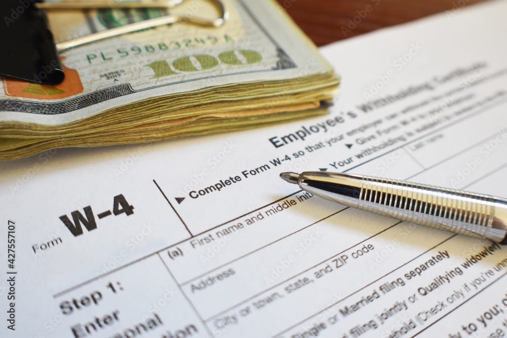 Tax Form W-4 Close Up With Pen And Money Stock Photo | Adobe Stock