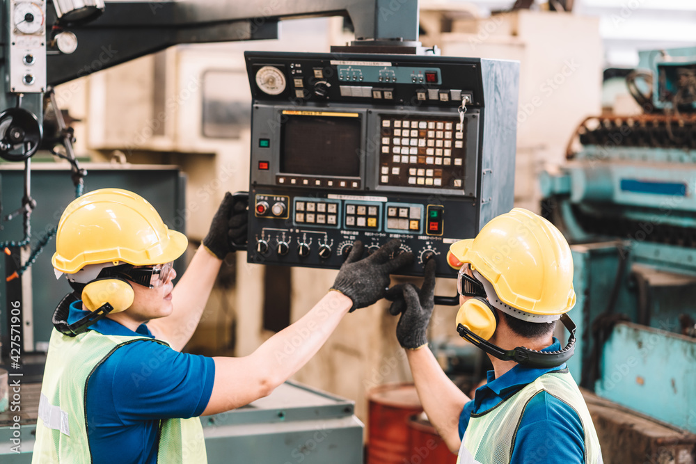 Work at factory.Asian worker man working in safety work wear with ...