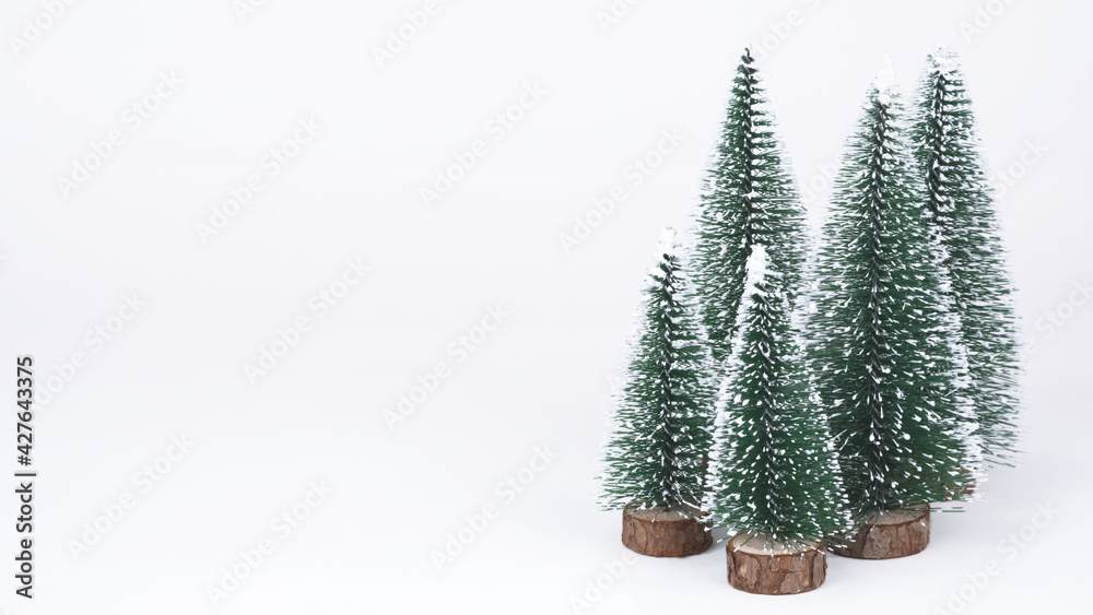 Group of miniature winter pine trees with snow is props decoration for ...