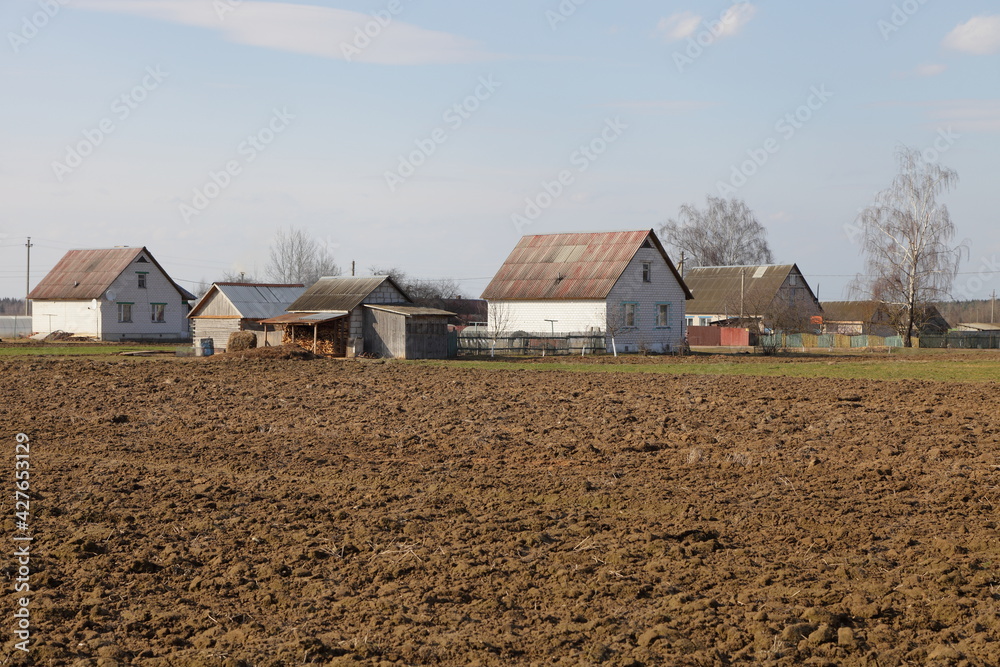 Russian rural landscape, farmers cottage houses on horison on ...
