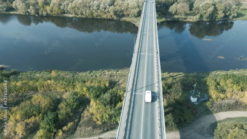 The movement of cars on a two-lane road bridge from a birds eye view ...