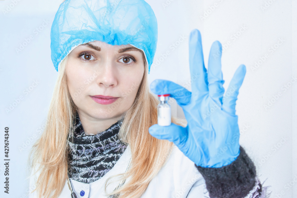 Vaccination promotion. Young woman doctor, nurse, scientist in a ...
