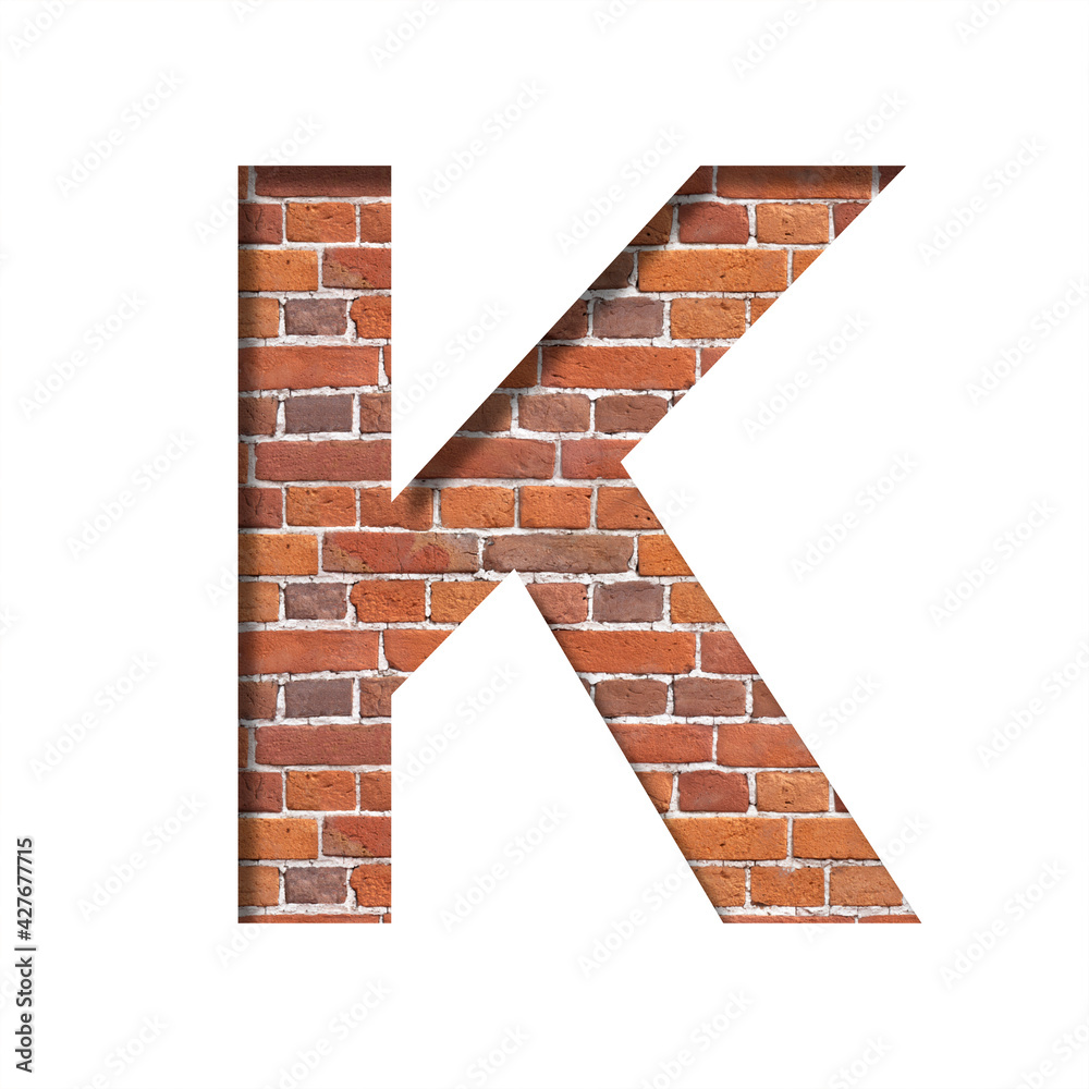 Font on brick texture. Letter K, cut out of paper on a background of ...