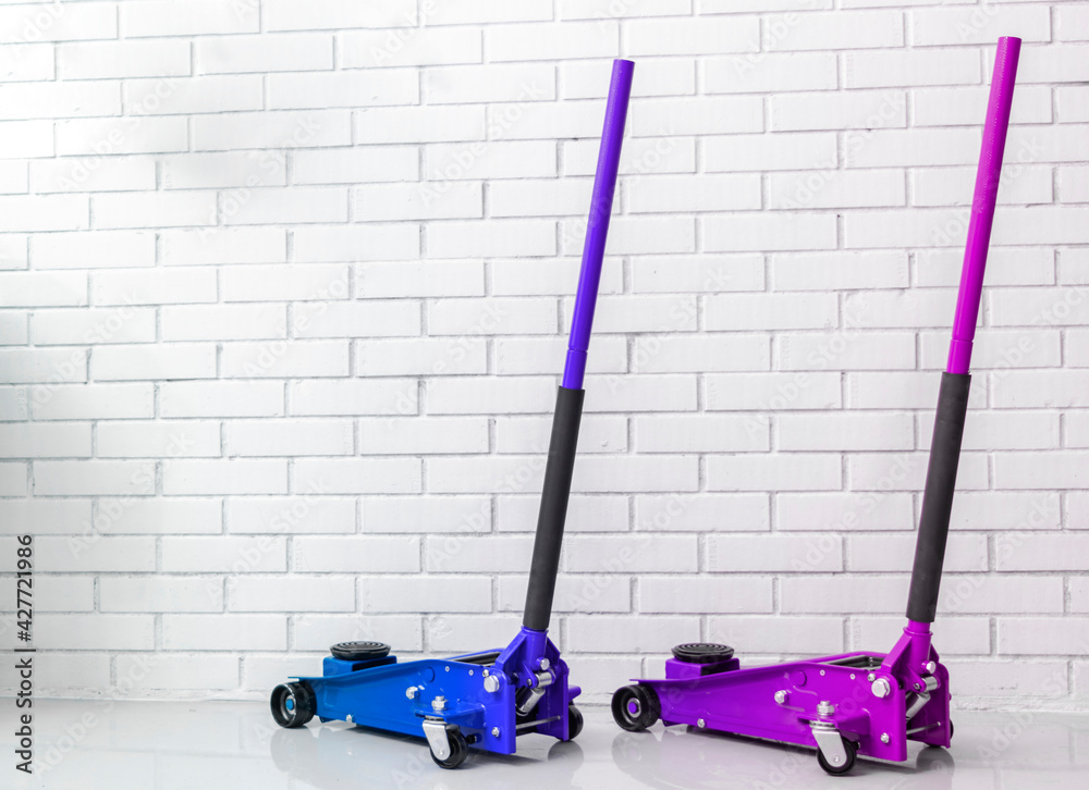 Hydraulic car floor jacks in blue and pink tones. Car Lift. Blue ...