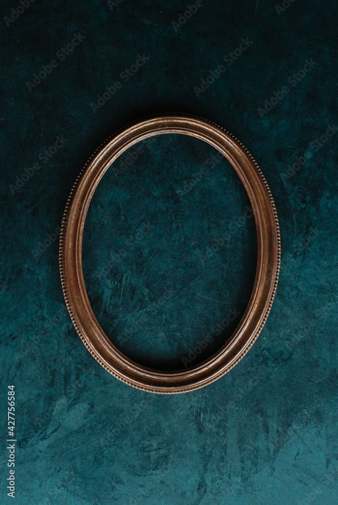 Wood vertical oval frame on a wall Stock Photo | Adobe Stock