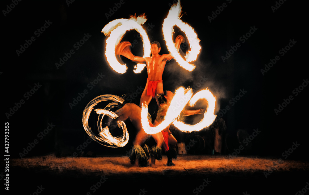 Luau hawaiian fire dancers motion blur tourist attraction in Hawaii or ...