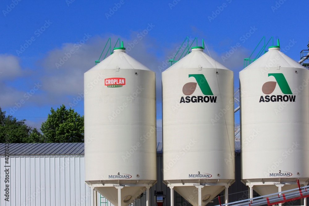 Asgrow and Croplan Grain storage tanks with blue sky and white clouds ...