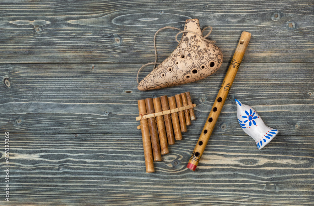 Russian folk wind instruments: two swirels, an ocarina, a clay whistle ...