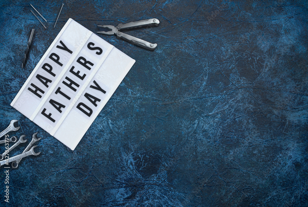 Happy Father's Day, a dark blue background with tools to the left and ...