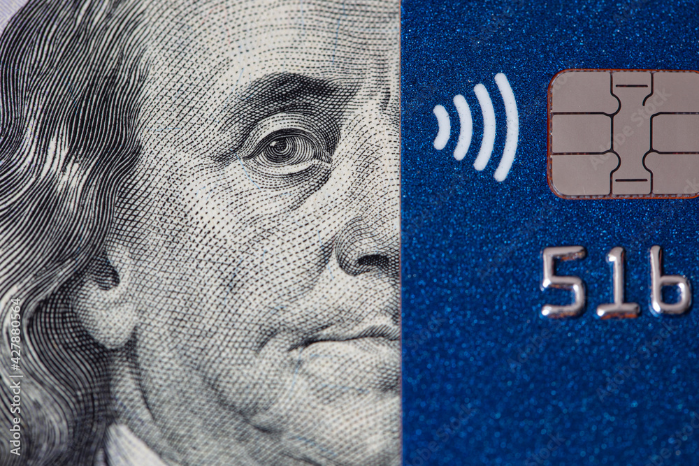 Debit card and US 100 dollar banknote Stock Photo | Adobe Stock