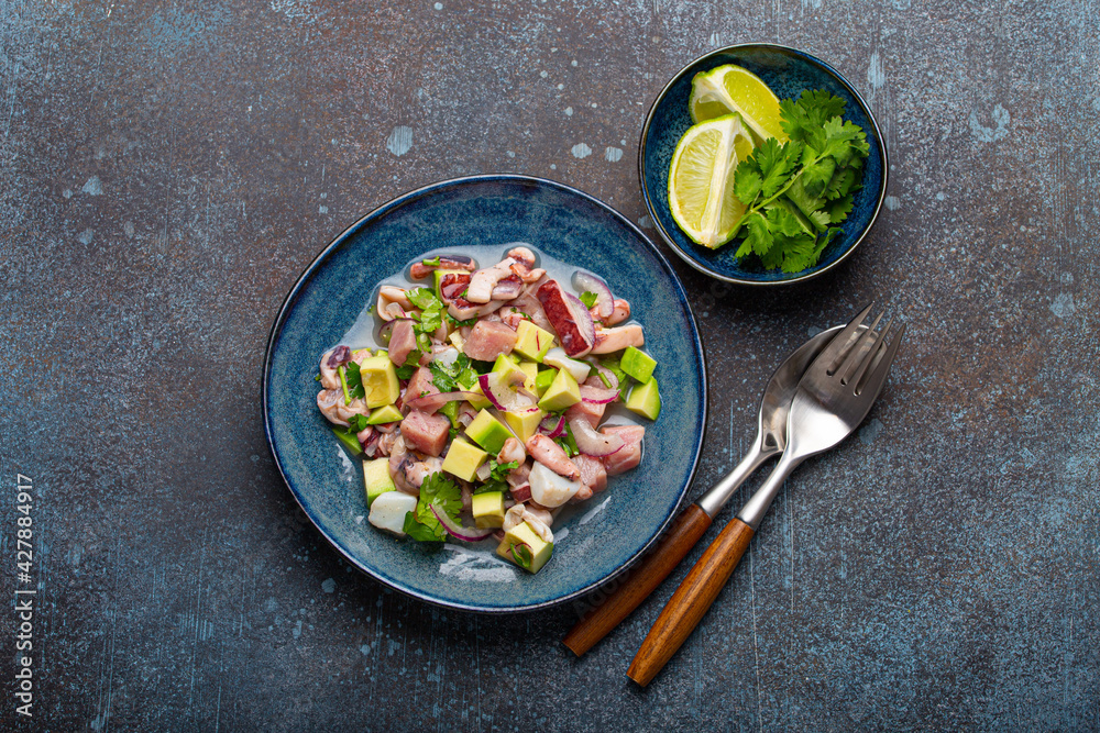 Peruvian ceviche with fresh fish, seafood, avocado on ceramic blue ...