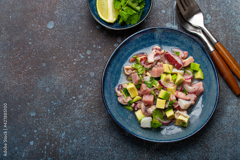 Peruvian ceviche with fresh fish, seafood, avocado on ceramic blue ...