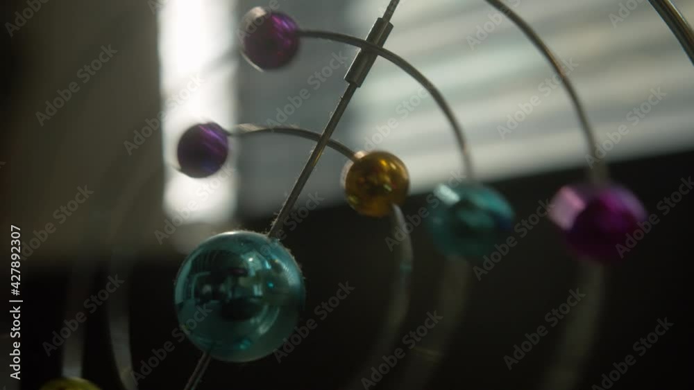 concentric rotating rings around a moving sphere. It looks like a ...