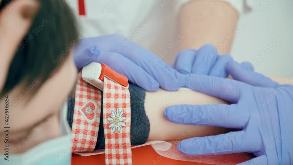 Finishing blood draw of patient close up and sterile treatment of ...