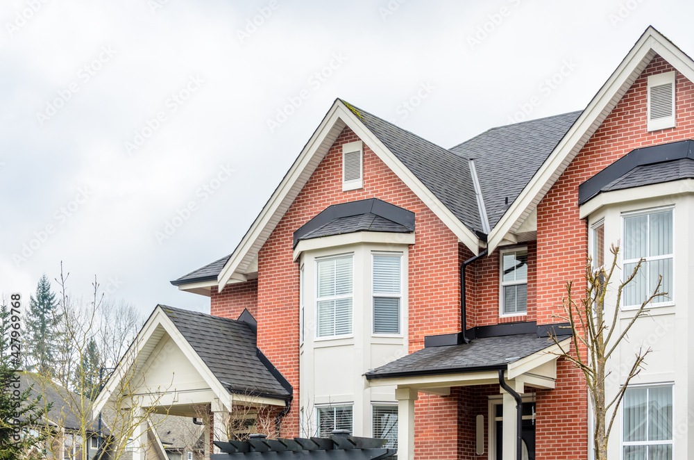 The top of the house with nice window. Stock Photo | Adobe Stock