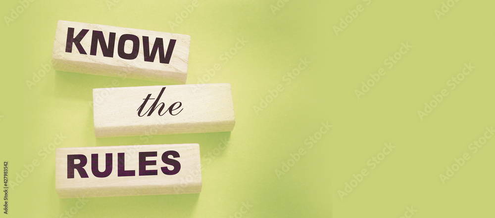 Know the rules word on wooden blocks isolated on dark grey background ...