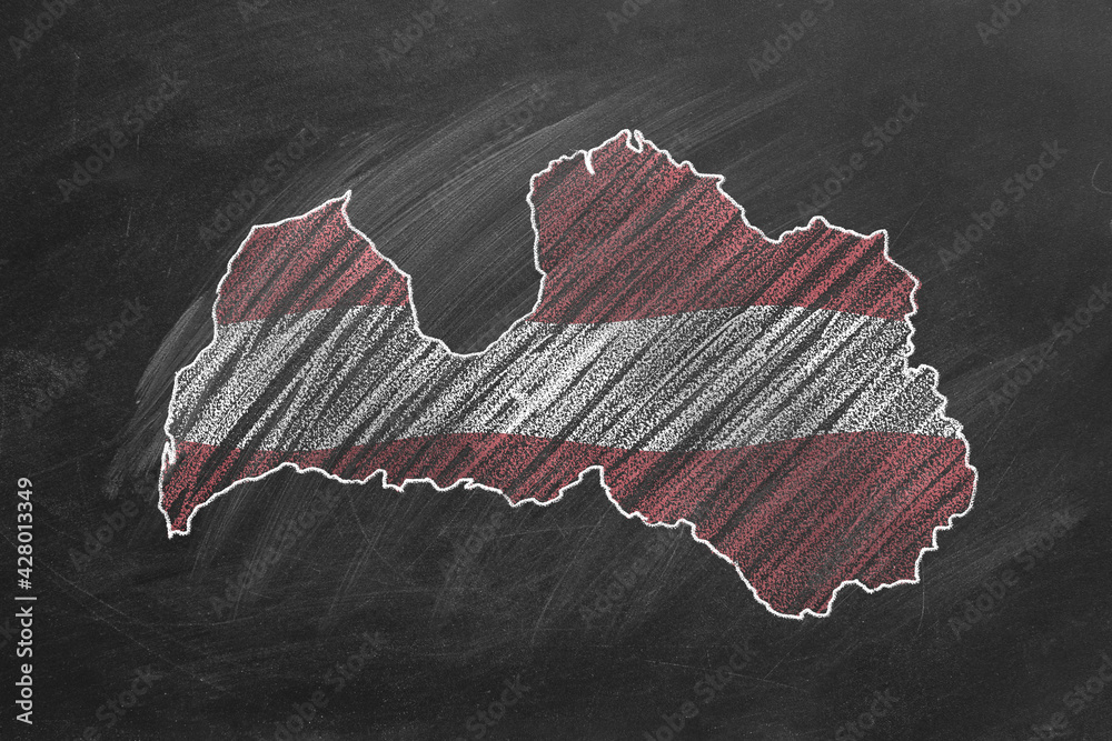 Country map and flag of Latvia drawing with chalk on a blackboard. One ...