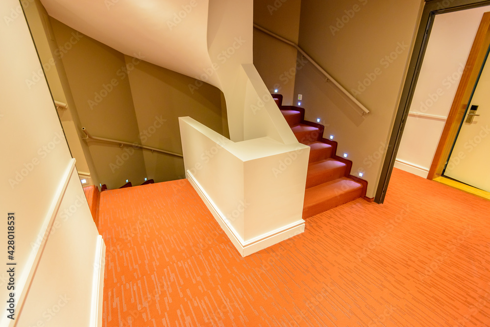 Staircase painted in red. Abstract fragment of the architecture of ...