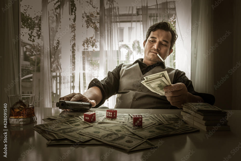 Gangster with bundles of cash, and guns, Bearded male dressed in a suit ...