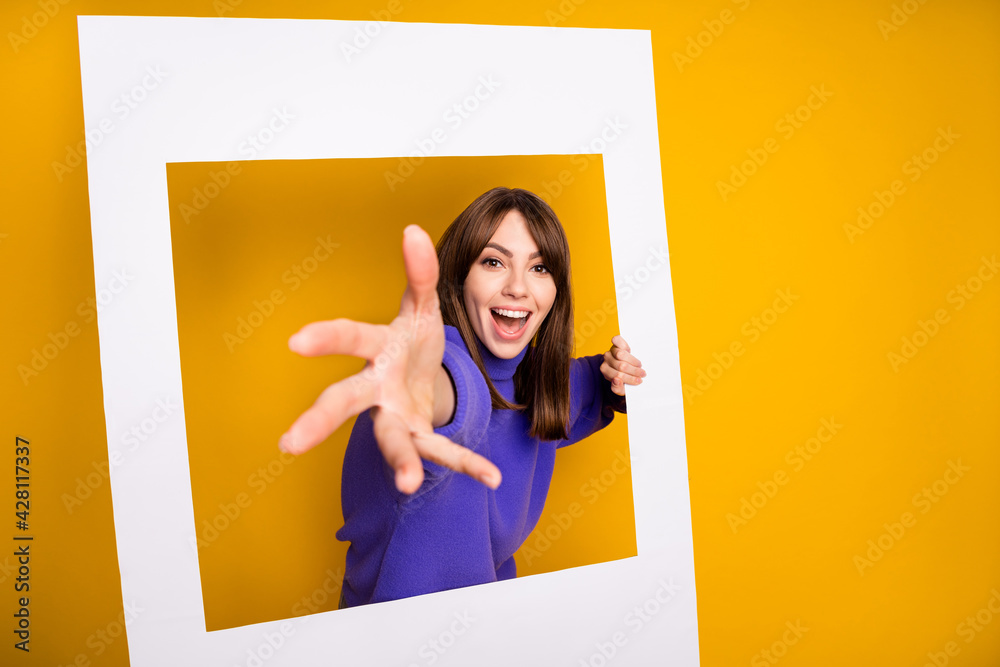 Portrait of attractive funny cheerful girl holding in hands big paper ...