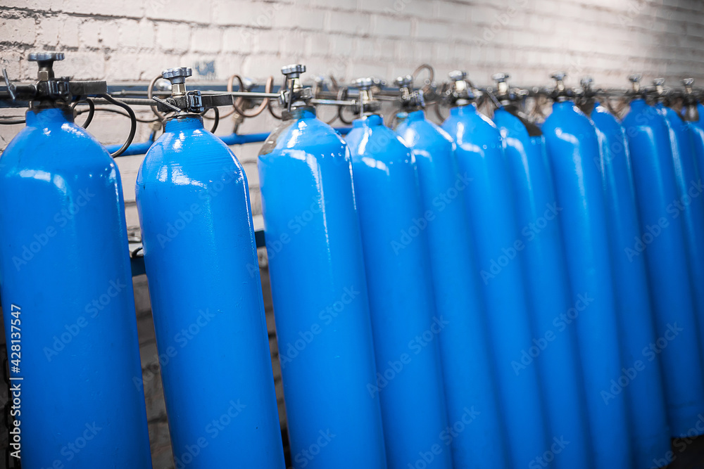 Oxygen cylinder with compressed gas. Blue Oxygen tanks for industry ...