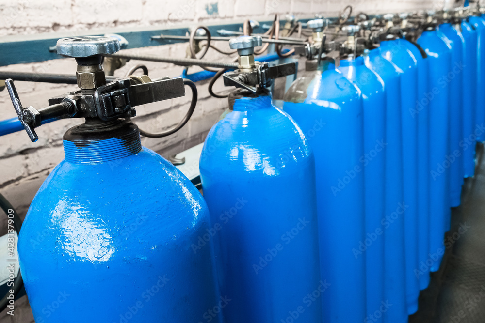 Oxygen cylinder with compressed gas. Blue Oxygen tanks for industry ...
