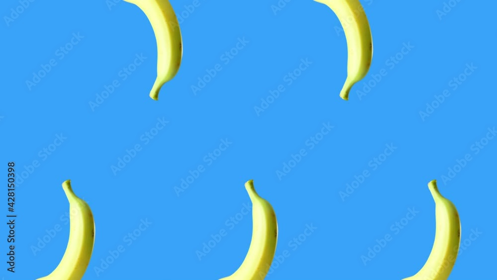 moving bananas in loop spinning motion at blue chroma key background ...