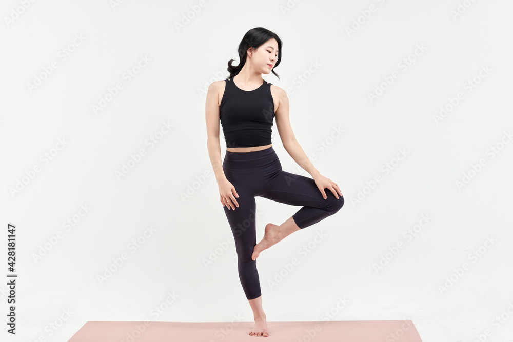 Asia korean girl long haired beautiful pilates or yoga athlete does a ...