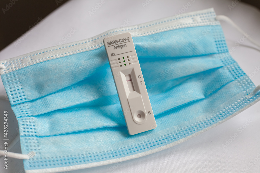 negative rapid antigen-test Covid-19 and medical mask Stock Photo ...