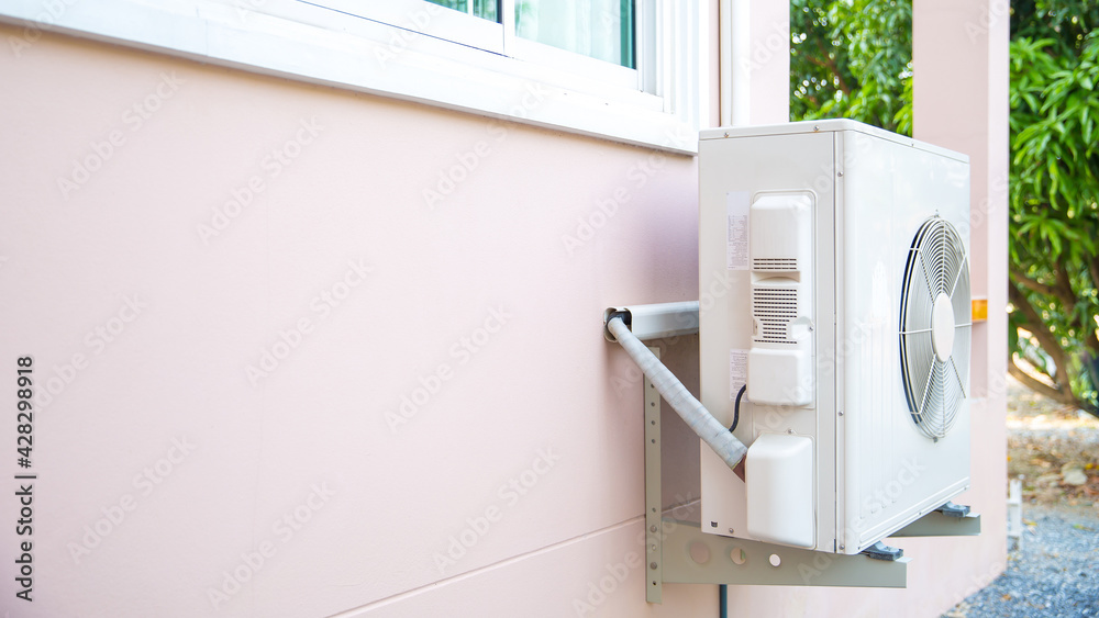 Air compressor, Close-up external split wall type of outdoor home air ...