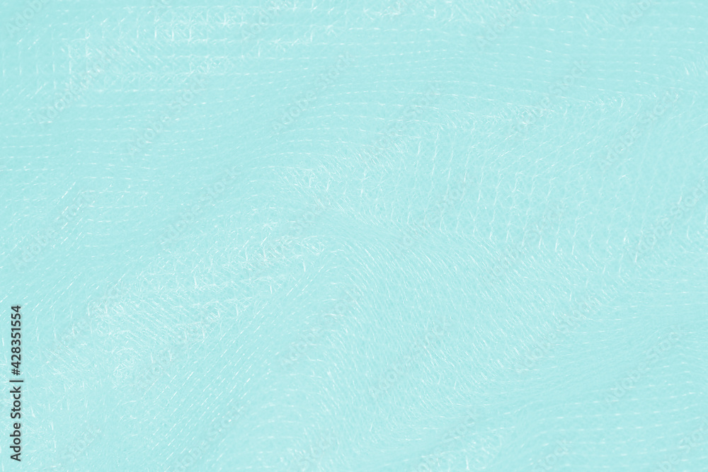 Textures and patterns of soft light blue net fabric with wavy folds are ...