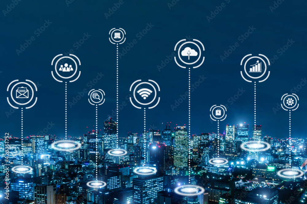 IOT (Internet of Things). global media link connecting on night city background, digital ...