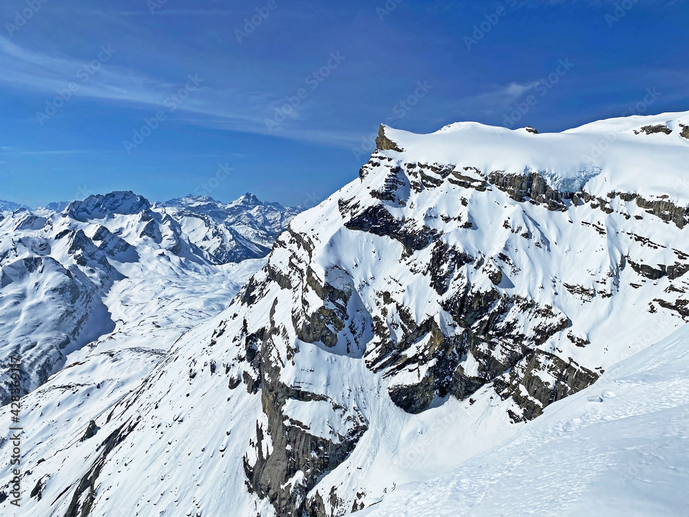 Spring icy alpine atmosphere on the Swiss mountain peaks viewed from ...