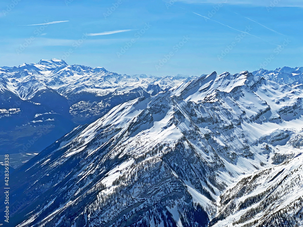 Spring icy alpine atmosphere on the Swiss mountain peaks viewed from ...