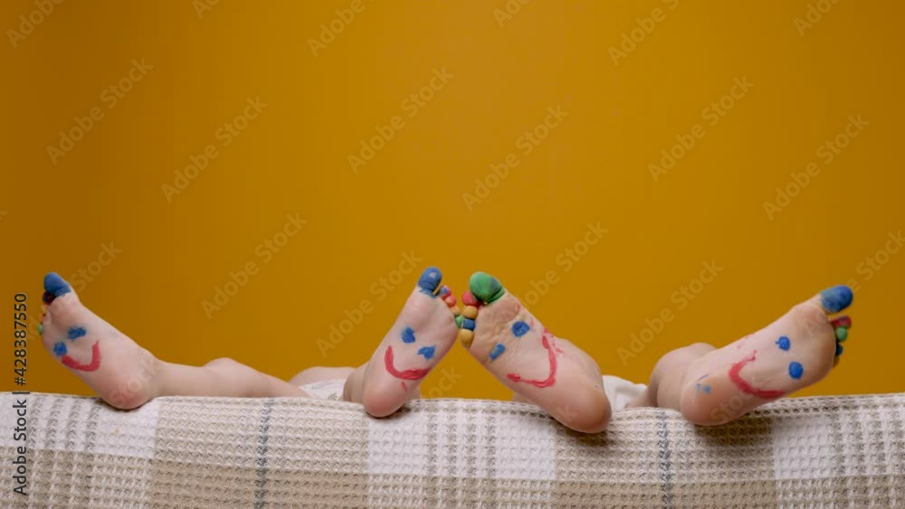Paint fun feet kids with smiley drawing toes. Barefoot child playing ...