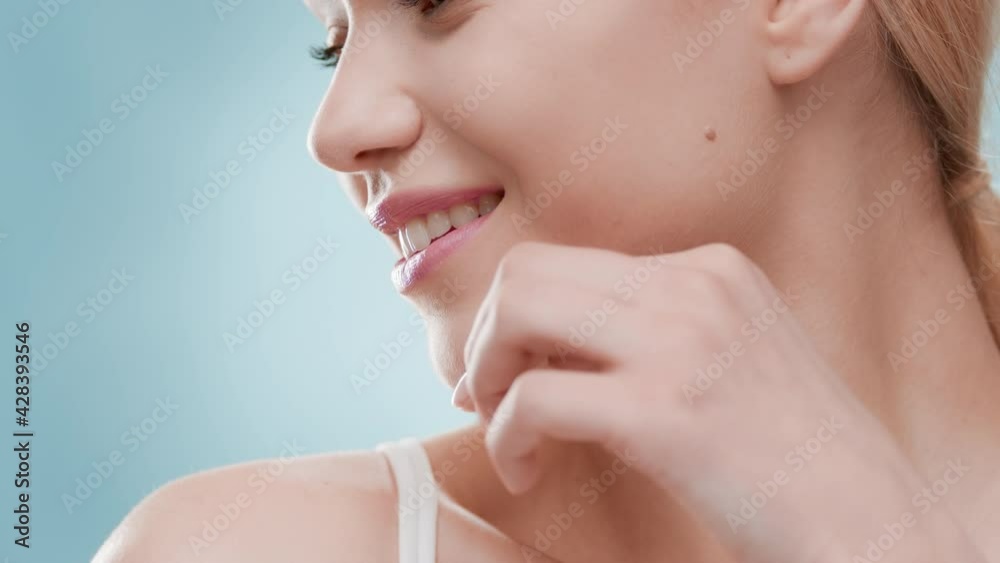 Young slim good-looking European woman with long golden hair in white ...