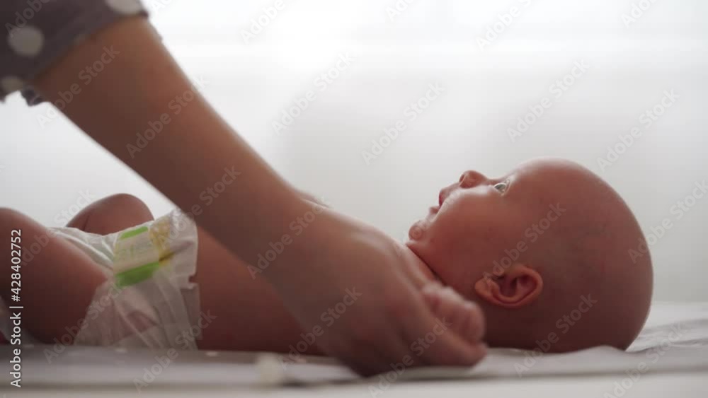 Video Stock Mother with baby boy doing exercise simple exercises to ...