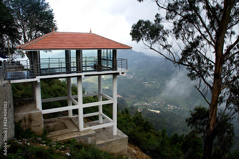 Viewing gallery above the scenic valley at Pillar Rock Point in Kodaikanal in Tamil Nadu, India ...