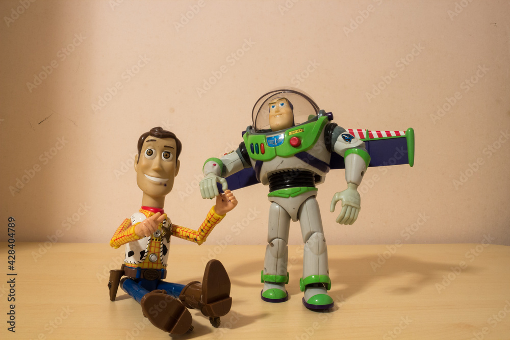 AVOLA, ITALY - Mar 21, 2021: Woody and Buzz Lightyear toys holding ...