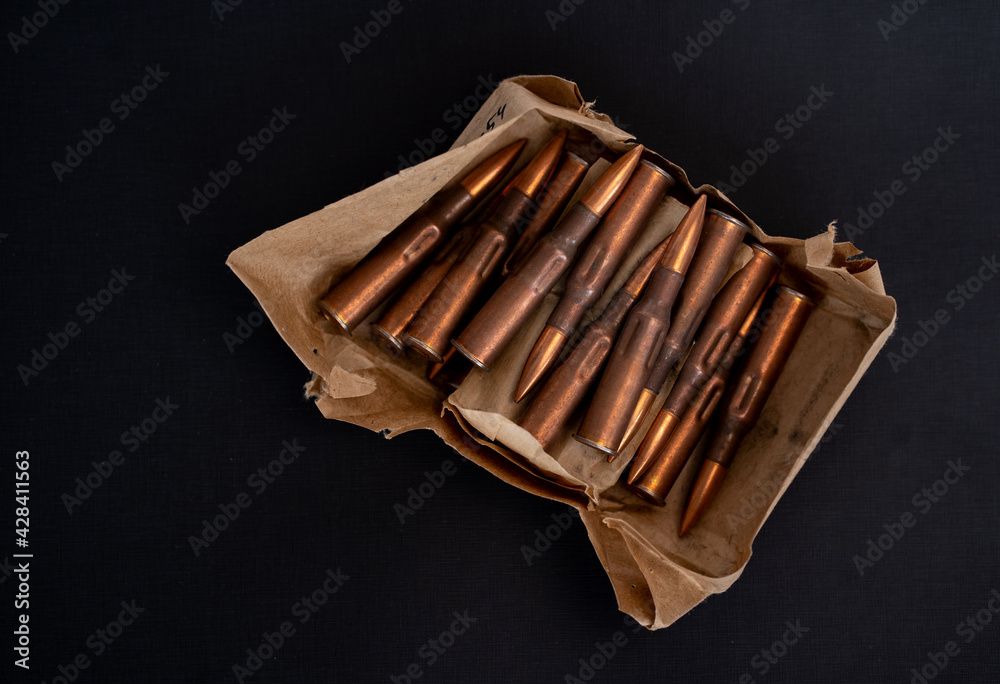 Cartridges 7.62x54 SVD (Dragunov sniper rifle) on a black background ...