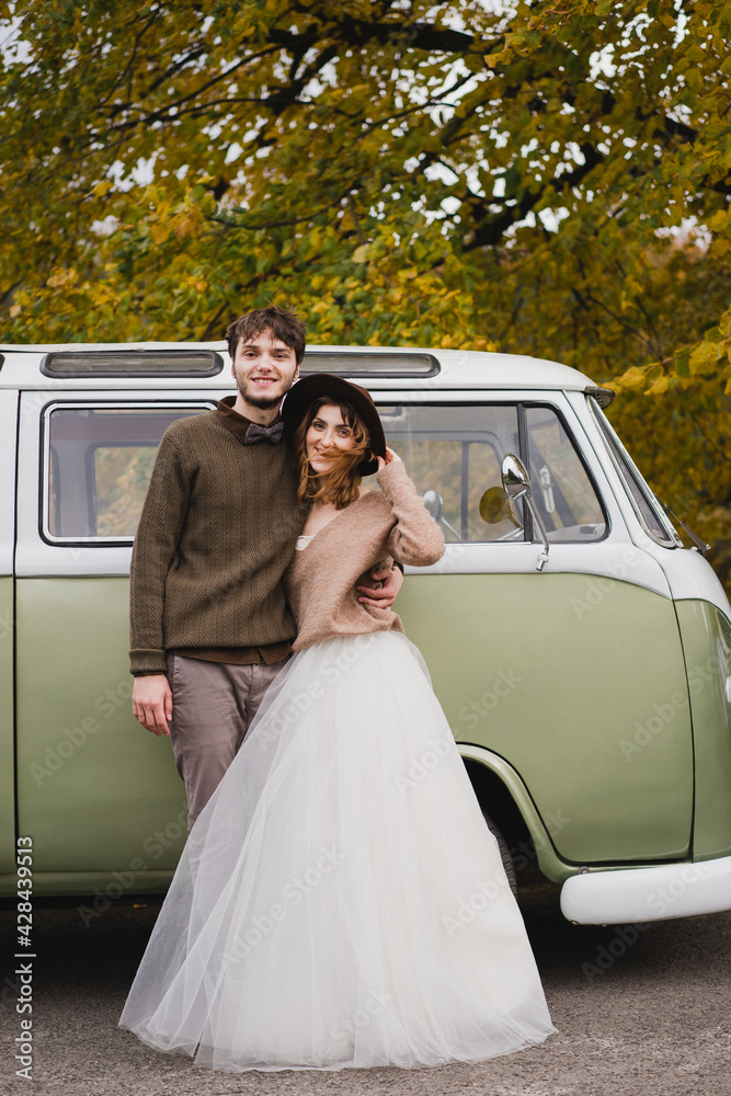 Romantic and happy caucasian couple in casual wedding clothes hugging ...