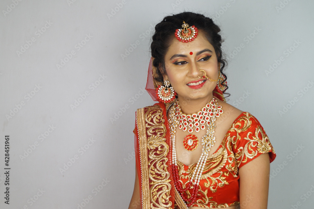 Beautiful Indian woman wearing her red wedding dress with bridal makeup ...