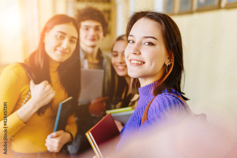 Happy young university students making selfie photo together while ...