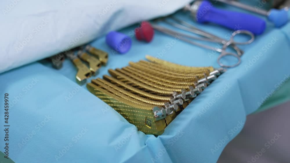 Medical instruments in operating room. Set of surgical tools on blurred ...