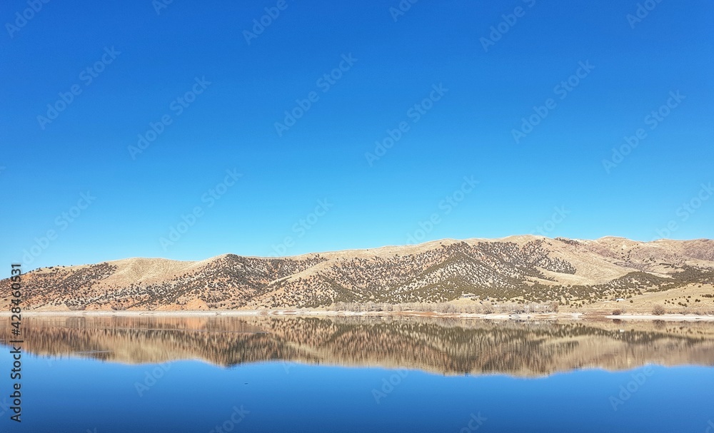 beautiful landscape of hills reflection at Echo Reservoir with stunning ...