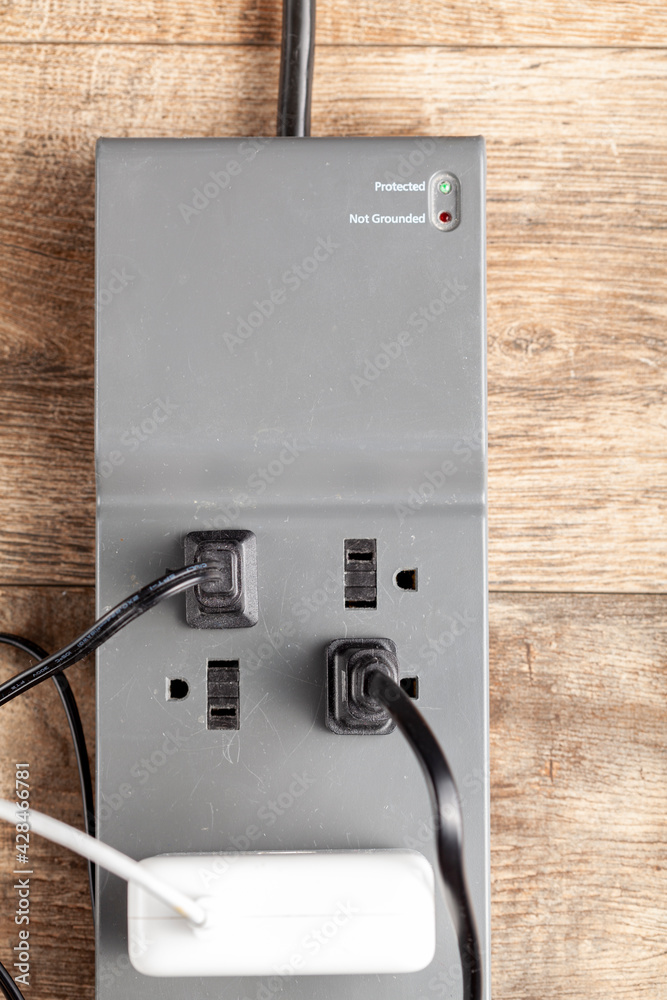 Fotka „Close up top view imge of a corded power strip with surge ...